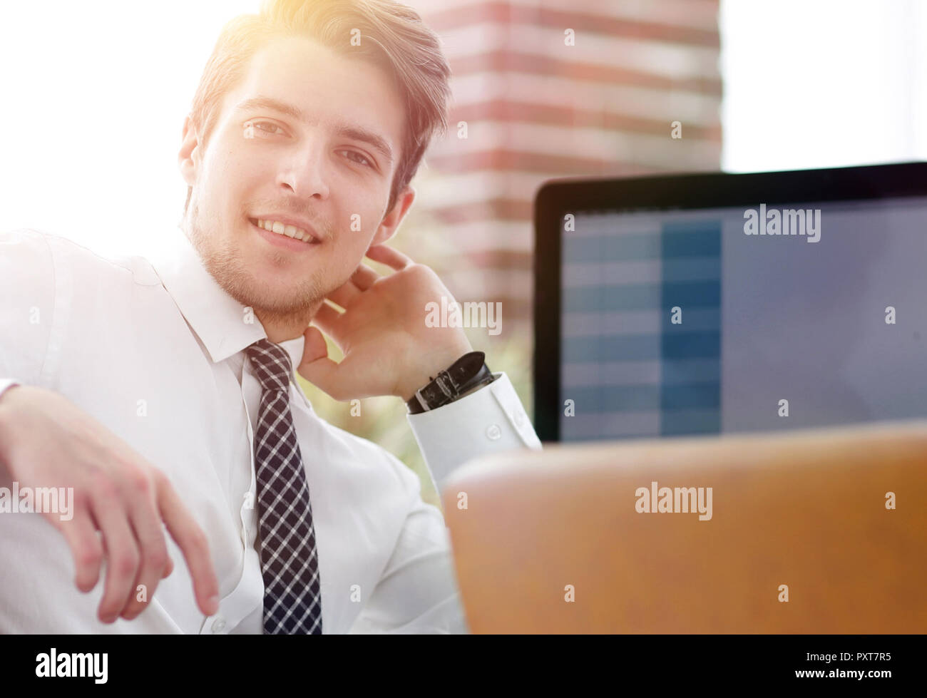 employee sitting in front of a computer screen Stock Photo - Alamy