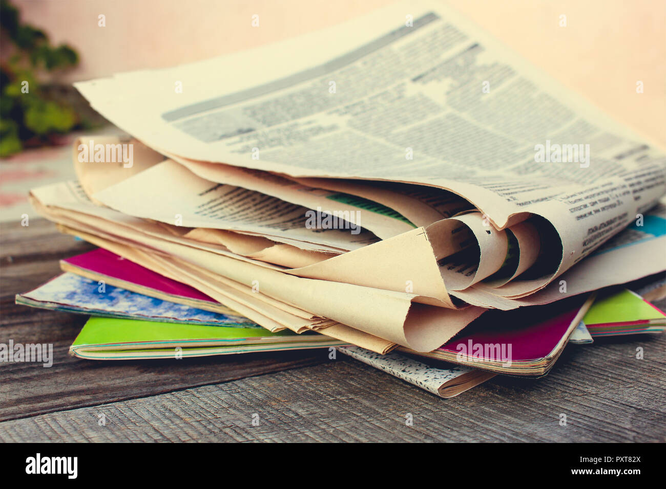Newspapers and magazines on old wood background. Toned image Stock ...