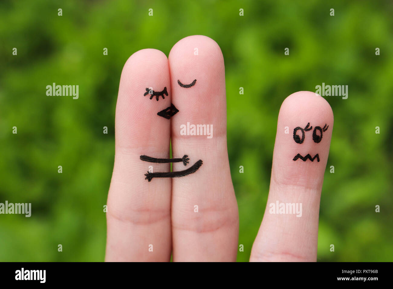 happy couple kissing and hugging. girl is jealous and angry Stock Photo ...