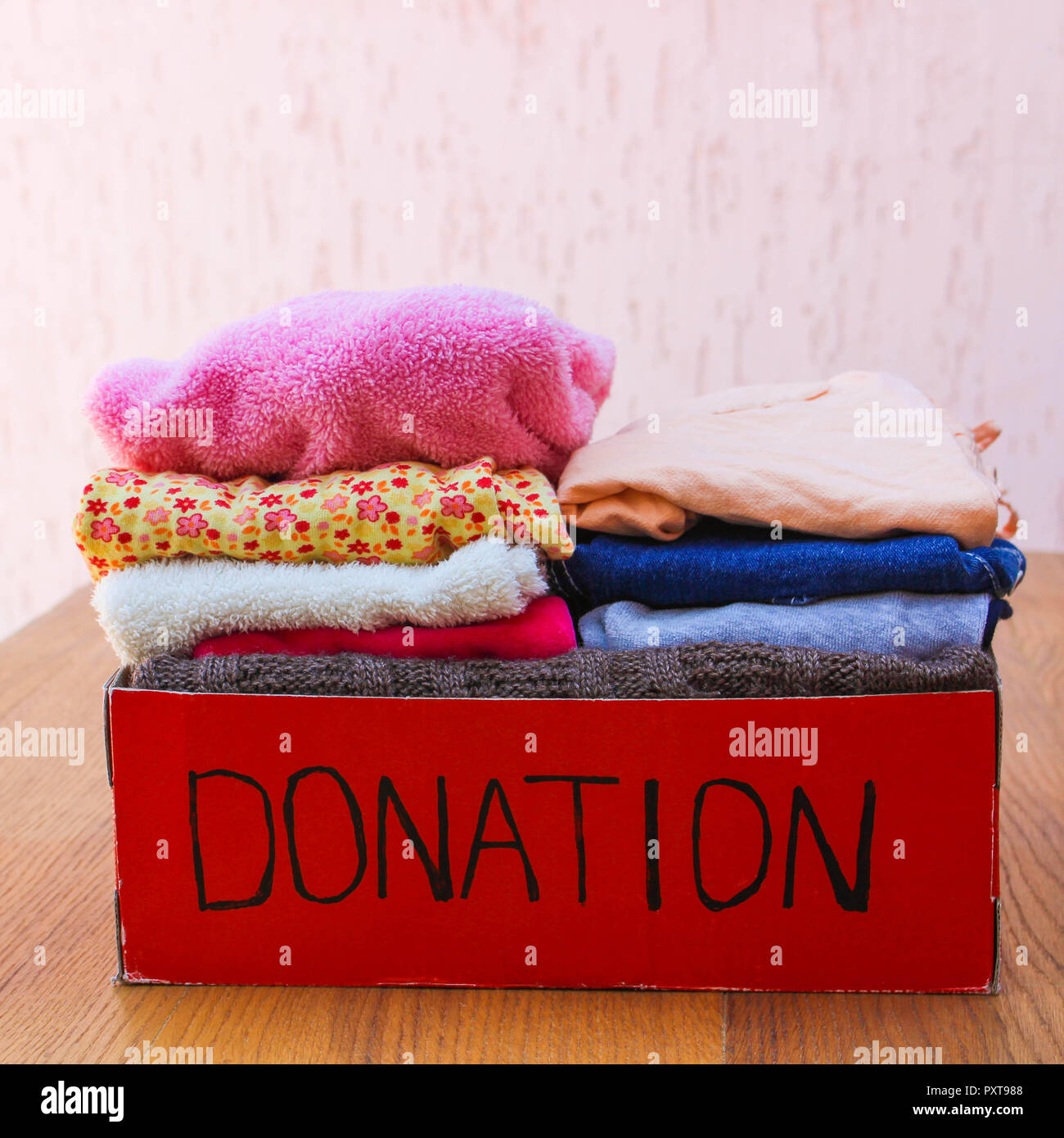 Donation box with clothes Stock Photo - Alamy