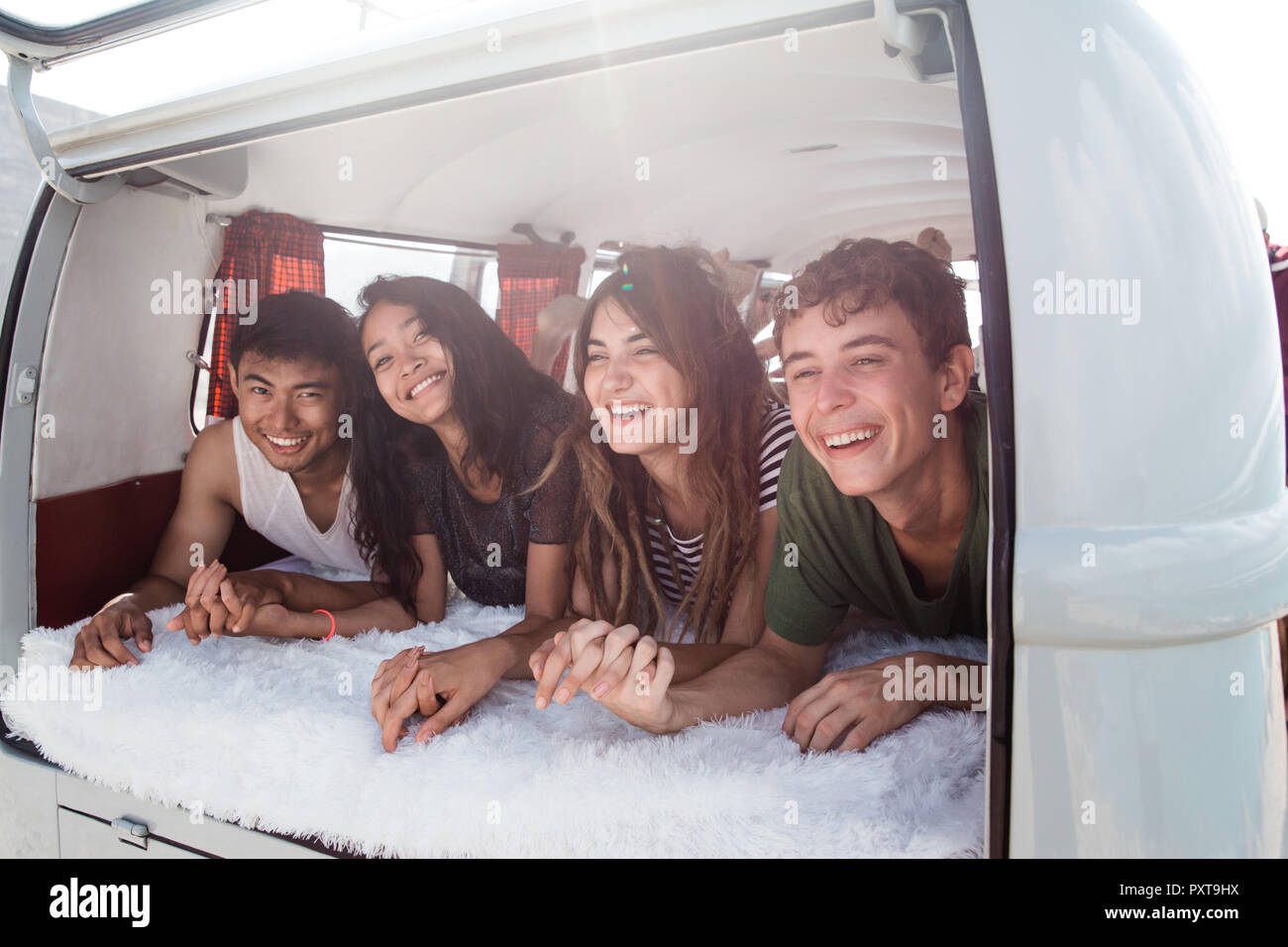 group of young people smiling lay down Stock Photo - Alamy