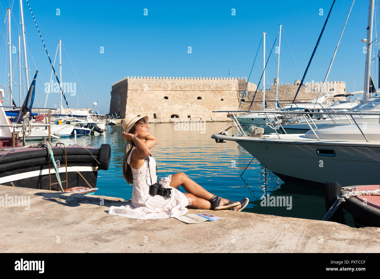 Happy tourist girl on holiday trip to Heraklion, Crete, Greece. Young ...