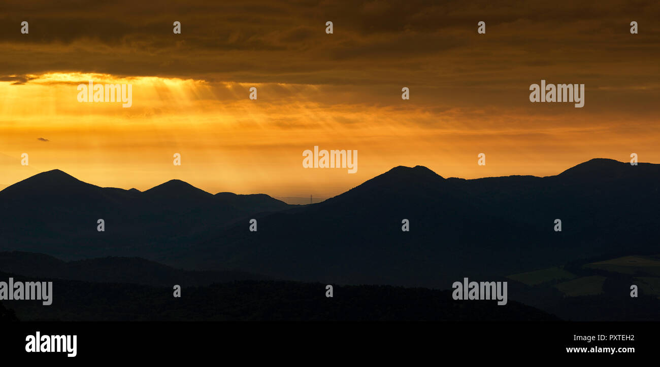 beautiful sun ray across mountain range during sunrise Stock Photo - Alamy