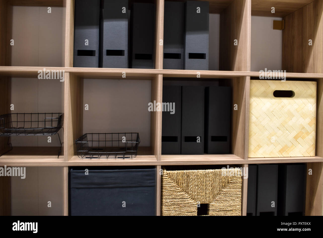 Storage shelves with binders and boxes Stock Photo - Alamy