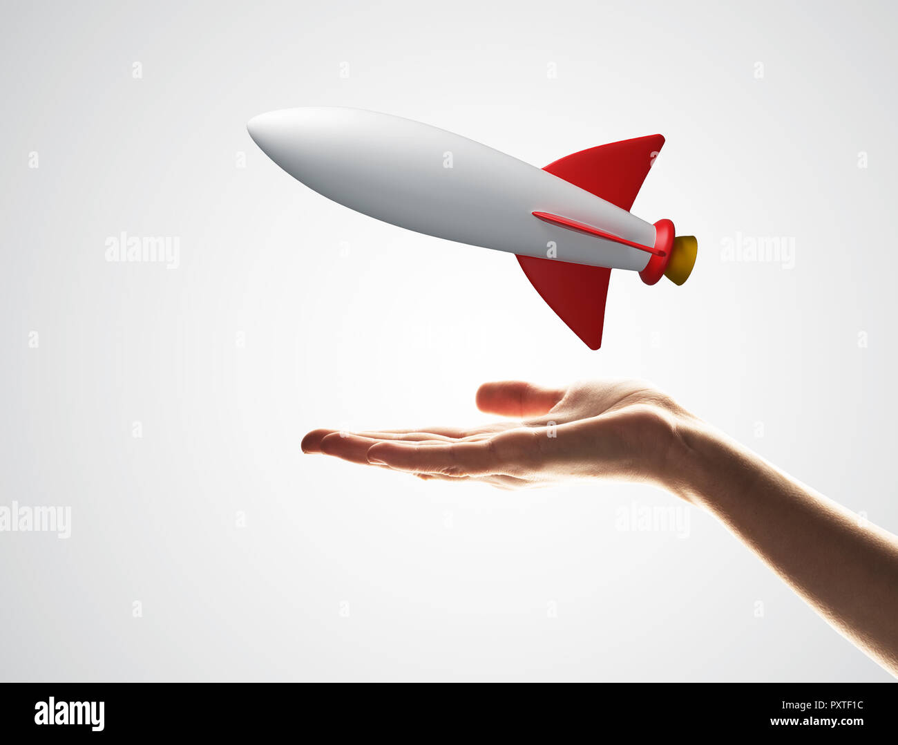 Rocket in hand as symbol for high technologies and science Stock Photo ...