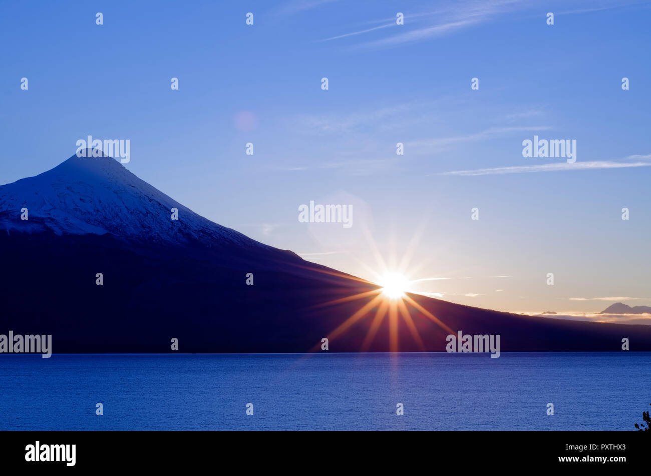 Beautiful sunrise on a shore of lake Llanquihue, located opposite the ...