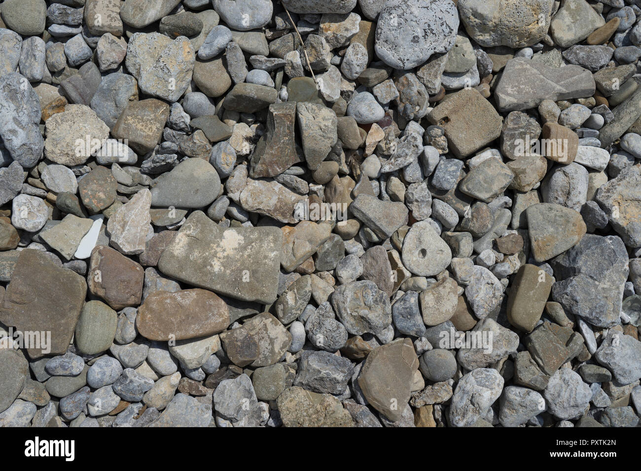 Natural background of stones of different sizes of gray. For design and ...