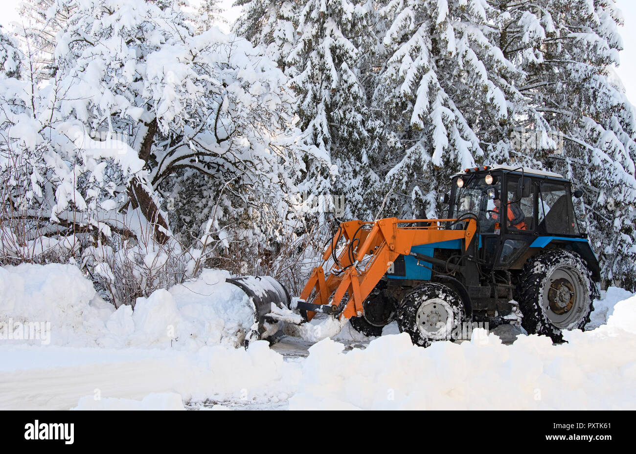 Tractor cleaning snow in winter hi-res stock photography and images - Alamy