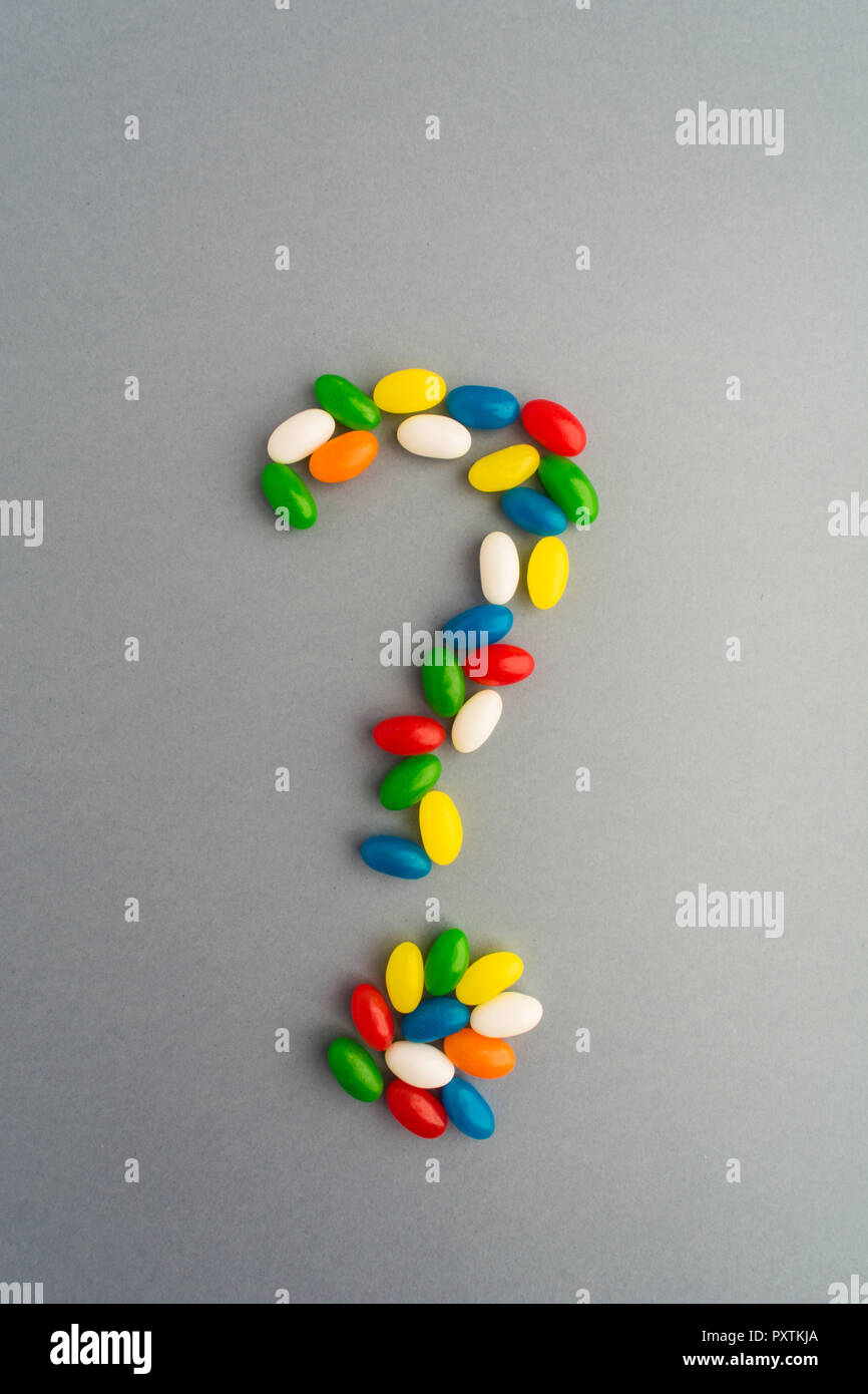 Colorful jellybean mark question over grey background Stock Photo - Alamy