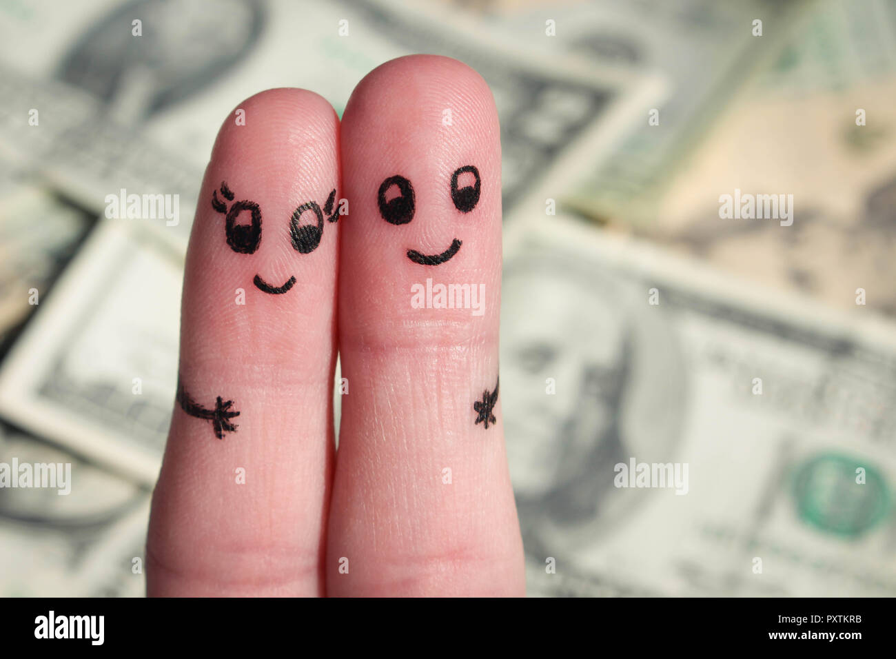 Finger art of a Happy couple hug on background of money Stock Photo - Alamy