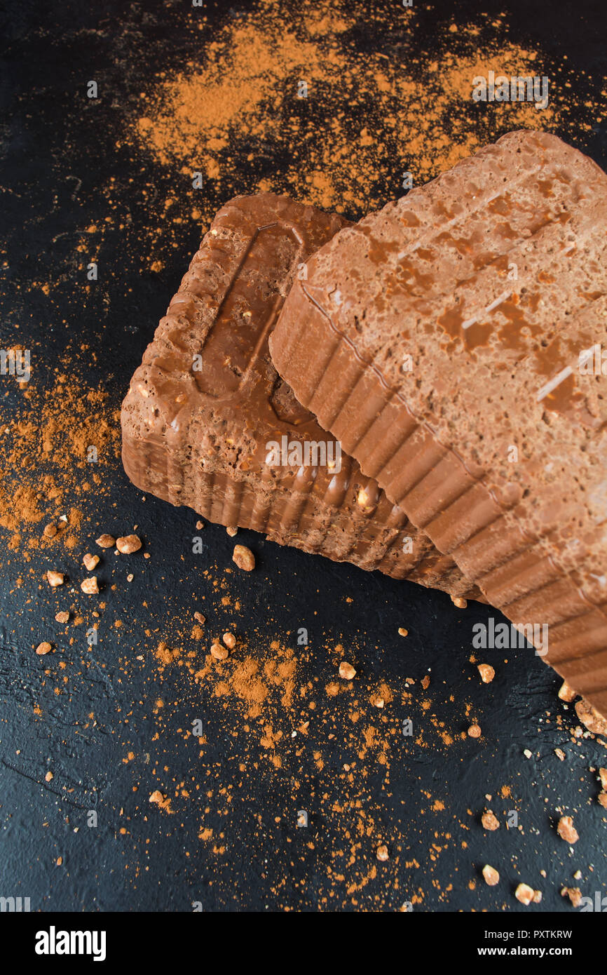 Two different big block milk chocolate with nuts Stock Photo - Alamy