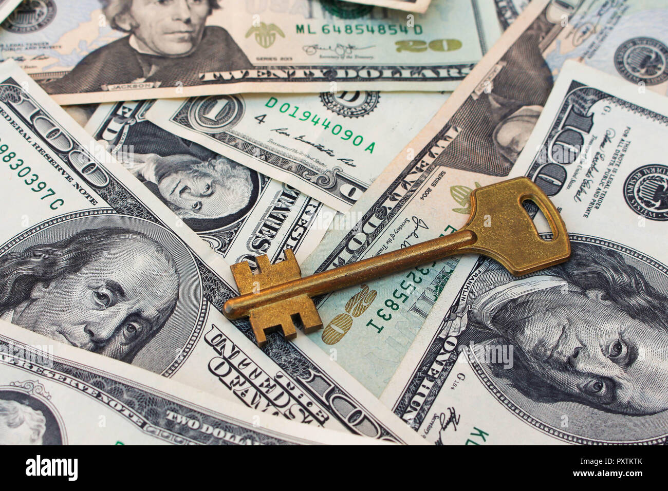 The keys on a background of money Stock Photo - Alamy