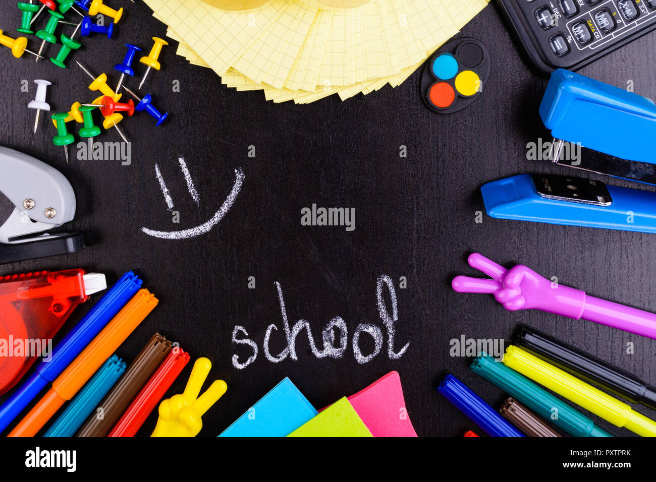 Different school tools on black board with message with small copy ...