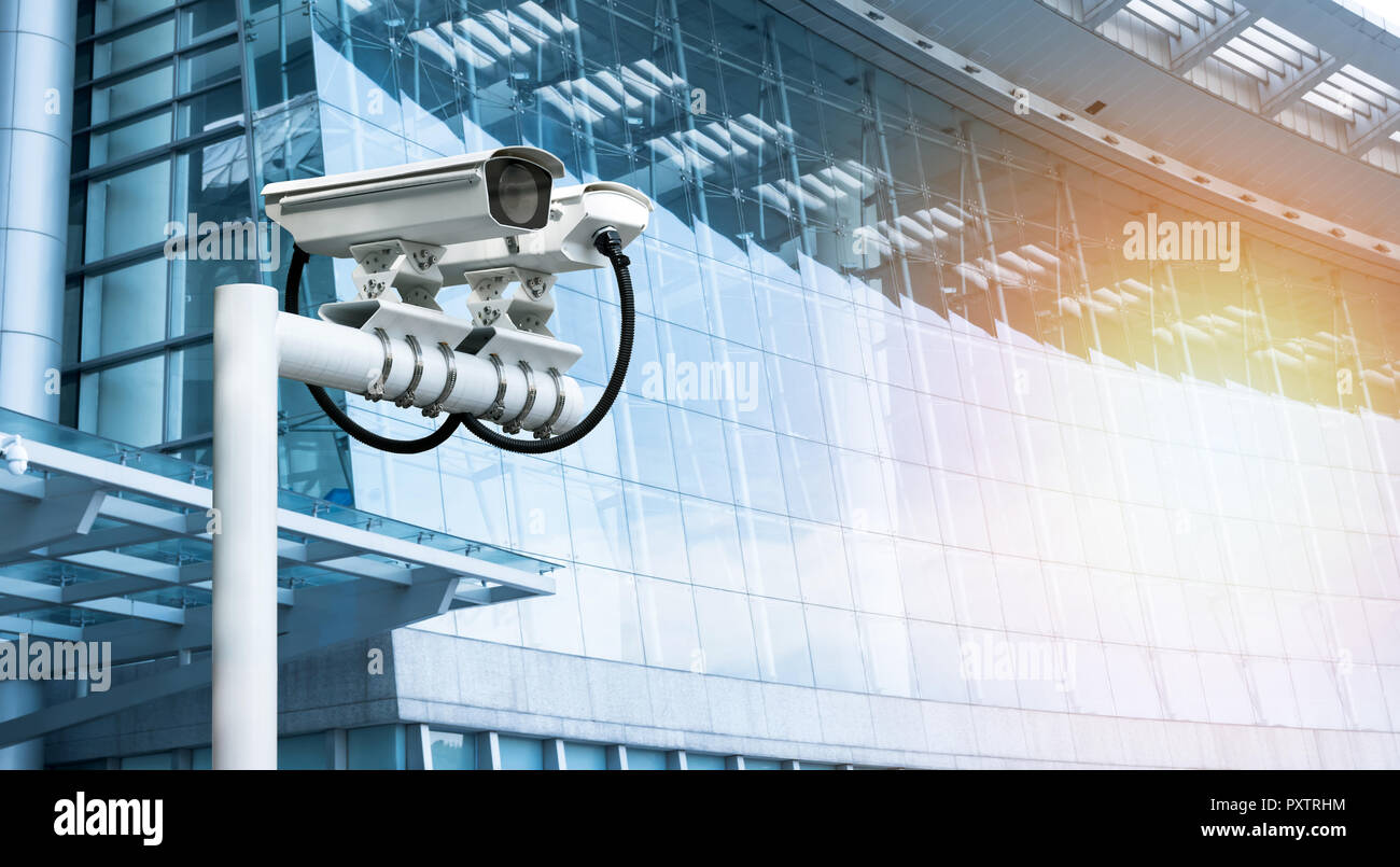 CCTV cameras, security cameras front of modern blue building with flare ...