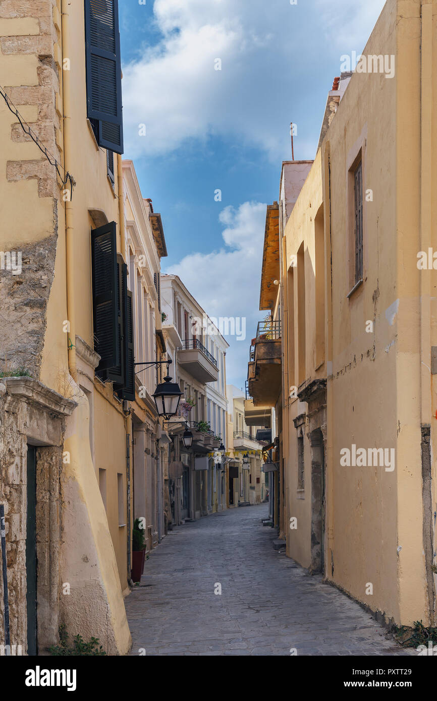 Narrow street in the old part of the Greek city with characteristic ...