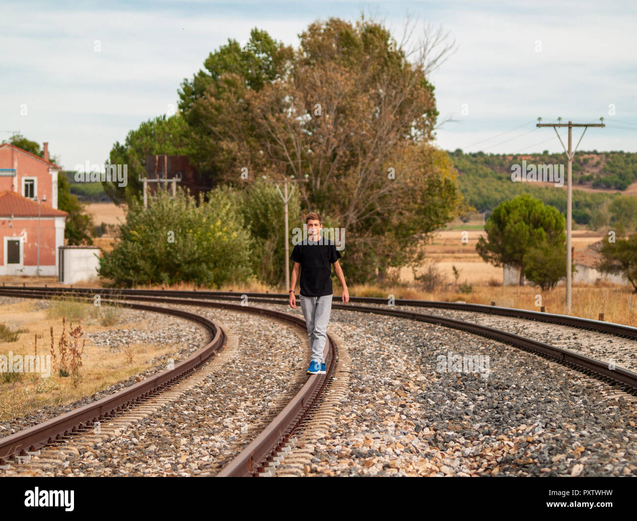Boy on railroad track hi-res stock photography and images - Alamy