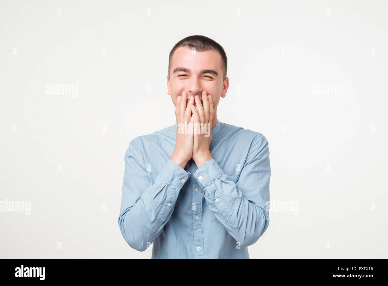 Man hand over mouth laughing hi-res stock photography and images - Alamy