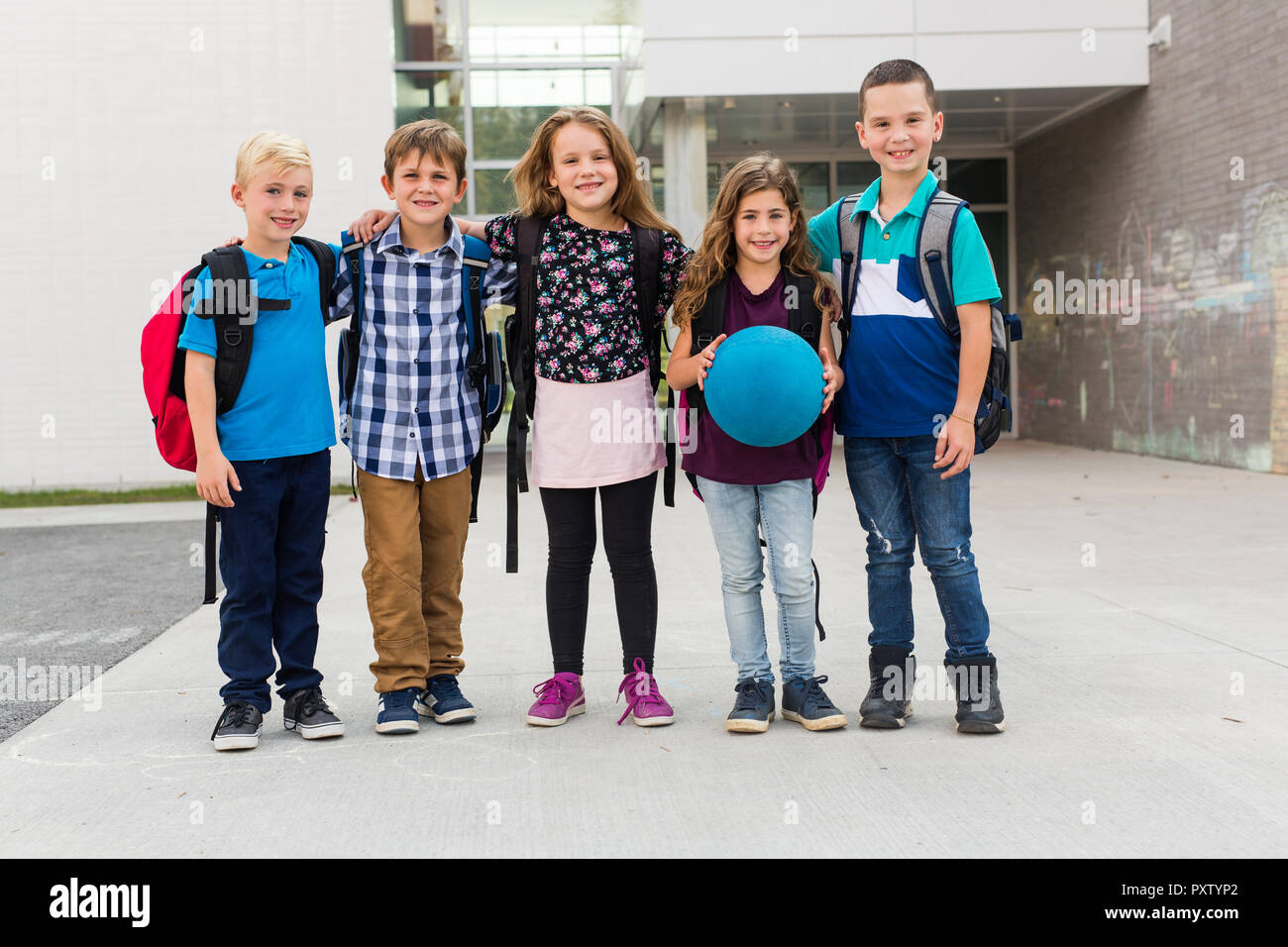 Great group Portrait Of School Pupil Outside Classroom Carrying Bags ...