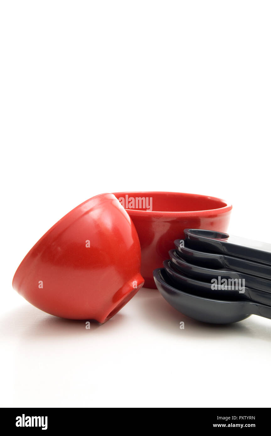 Measuring Red Cup and Black Measuring Spoons Horizontal Stock Photo - Alamy