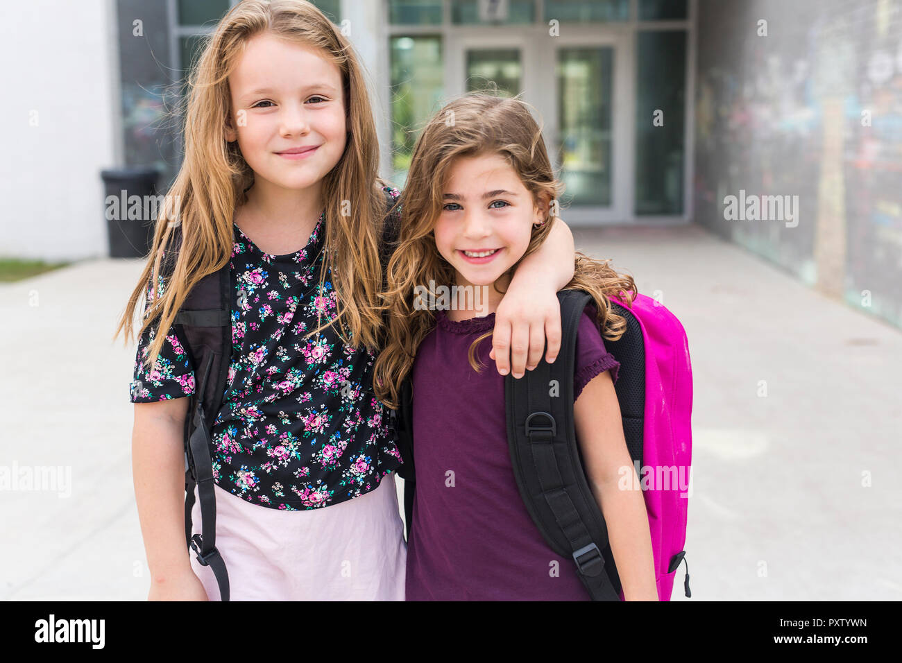 two childs girls at elementary school outside Stock Photo - Alamy