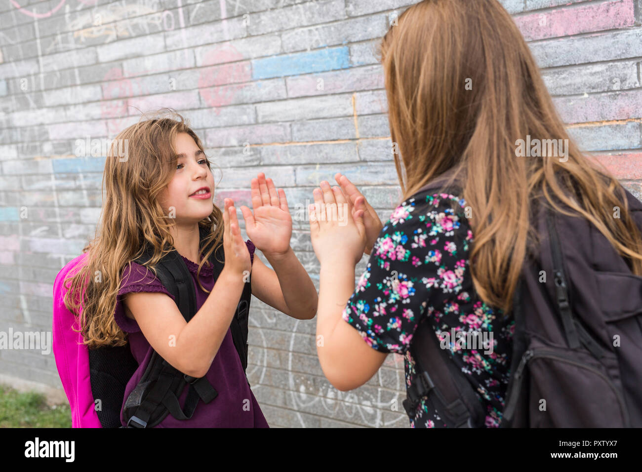 two childs girls at elementary school outside Stock Photo - Alamy