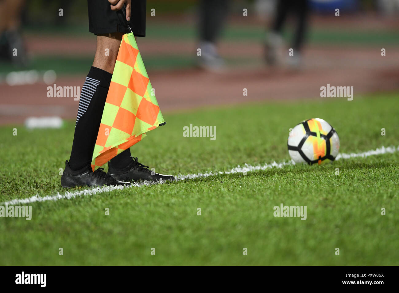 Assistant referee hold flag Stock Photo - Alamy
