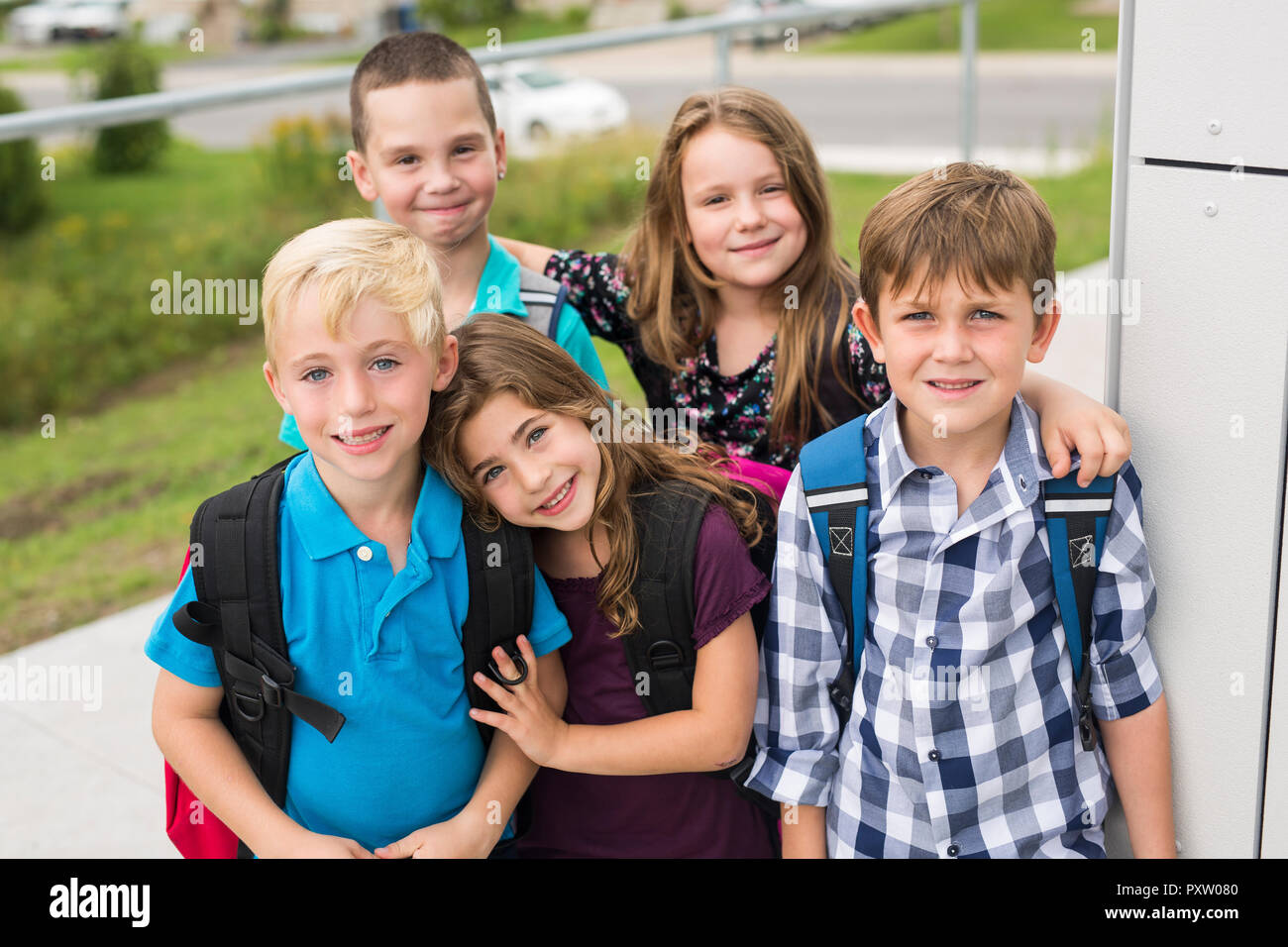 Great group Portrait Of School Pupil Outside Classroom Carrying Bags ...