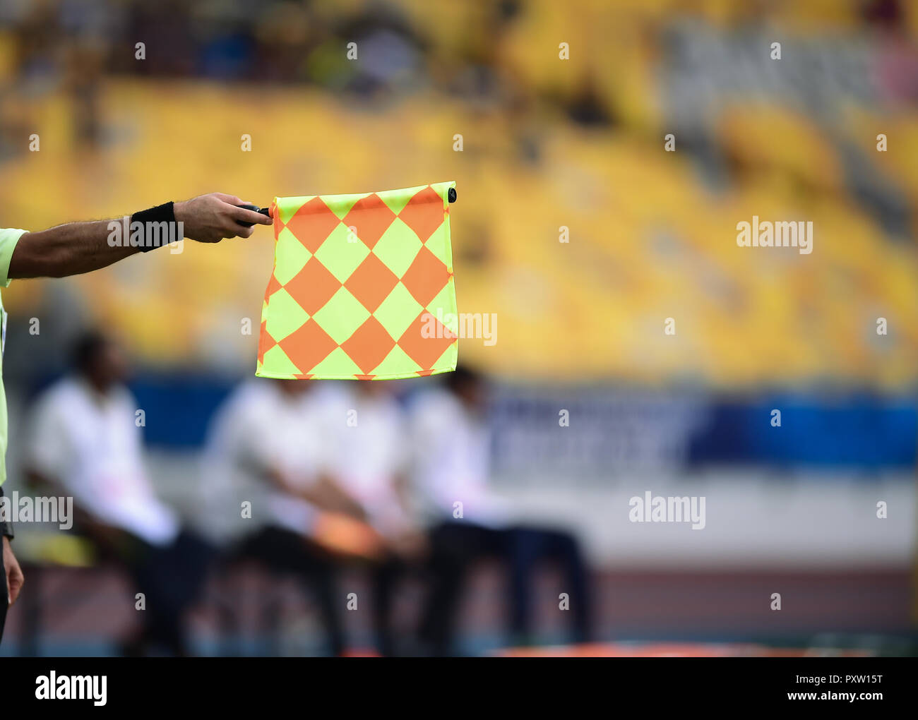 Assistant referee hold flag,offside signal Stock Photo - Alamy