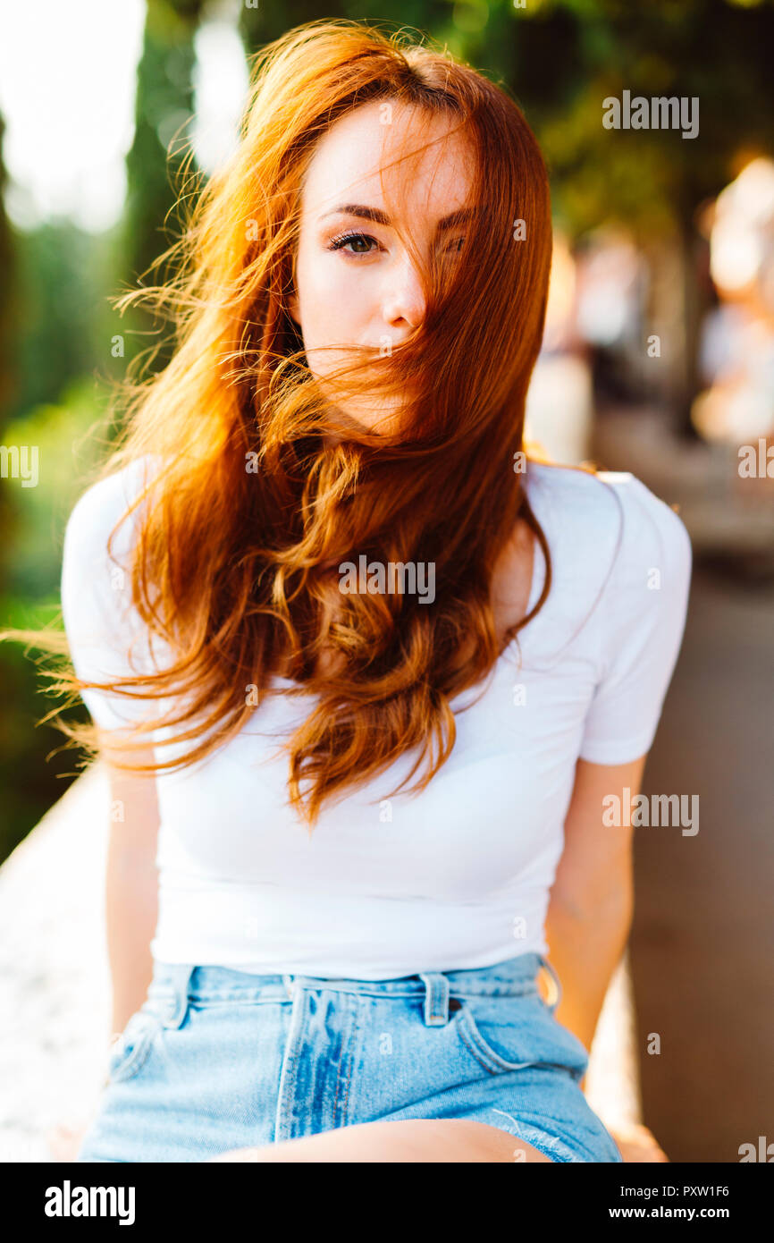 Portrait of redheaded woman with blowing hair Stock Photo - Alamy