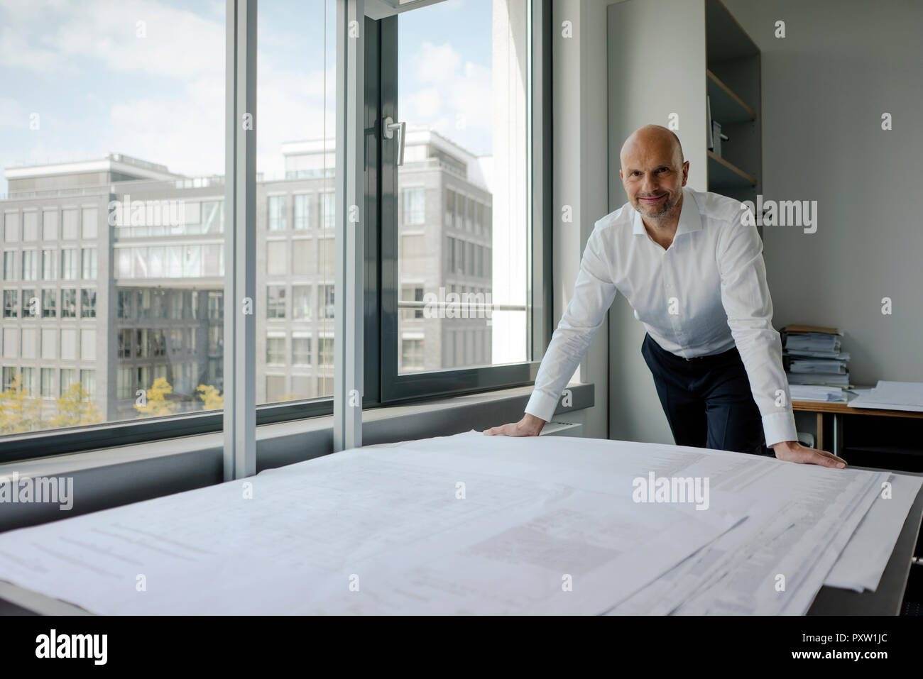 Engineer working in his office Stock Photo - Alamy