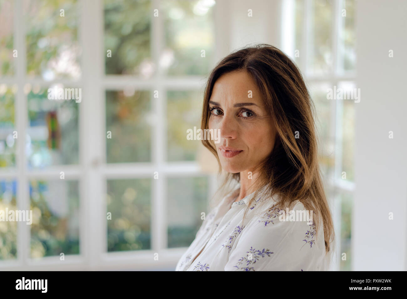 Portrait serious mature brunette woman window hi-res stock photography ... Portrait serious mature brunette woman window hi-res stock photography ...