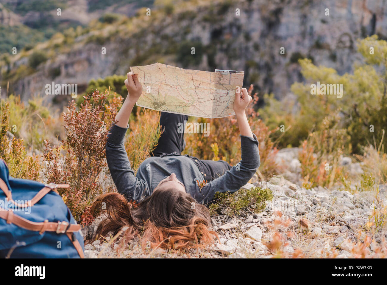 Spain, Alquezar, young woman with hiking map in nature Stock Photo - Alamy