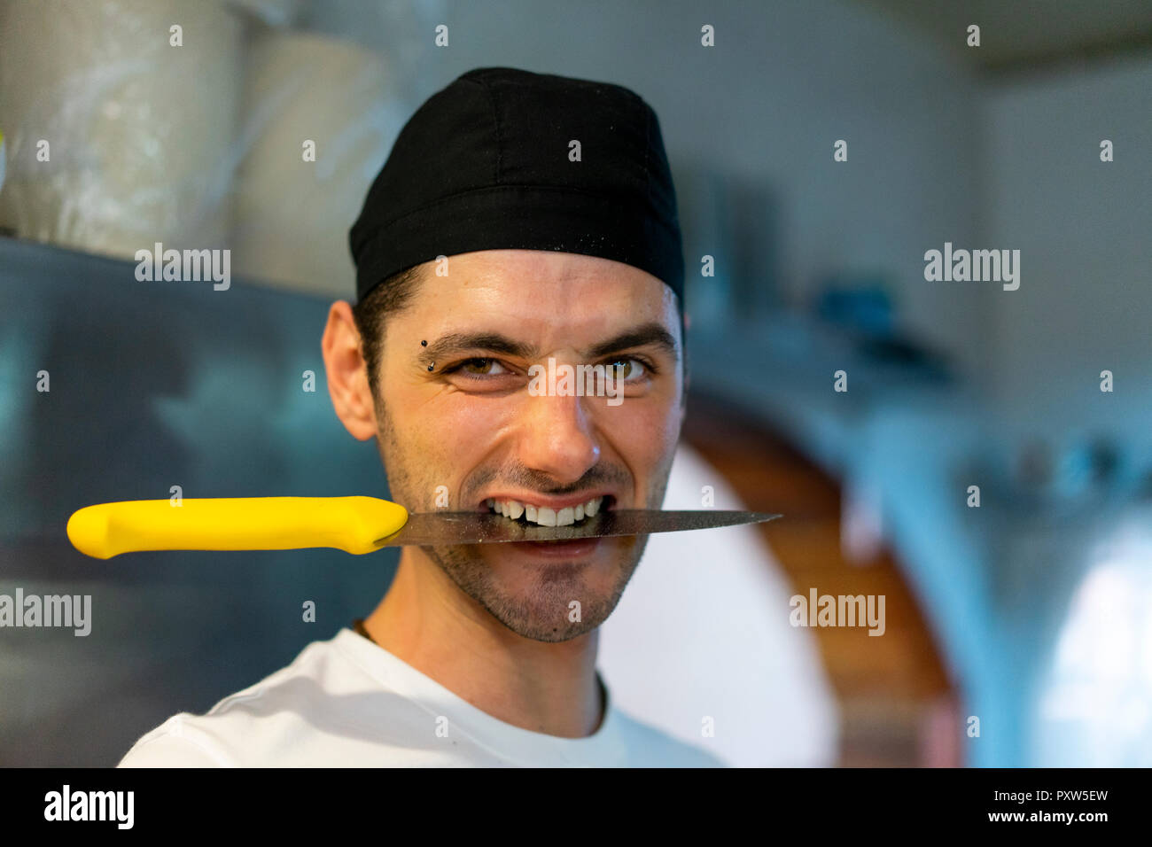 Knife between teeth hi-res stock photography and images - Alamy
