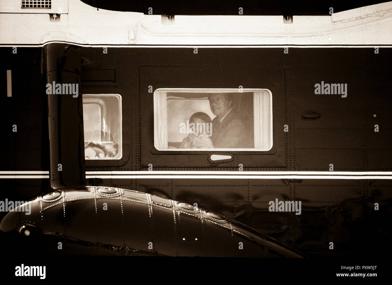 President Jimmy Carter holds grandson Jason Carter in the window of ...