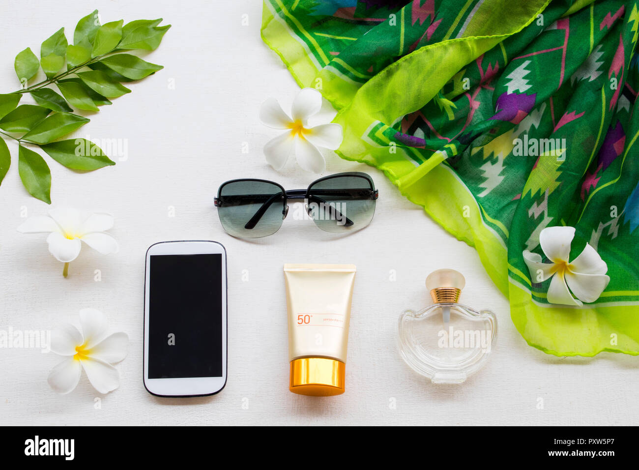 sunscreen spf50 ,sunglasses ,perfume ,mobile phone with green scarf ...