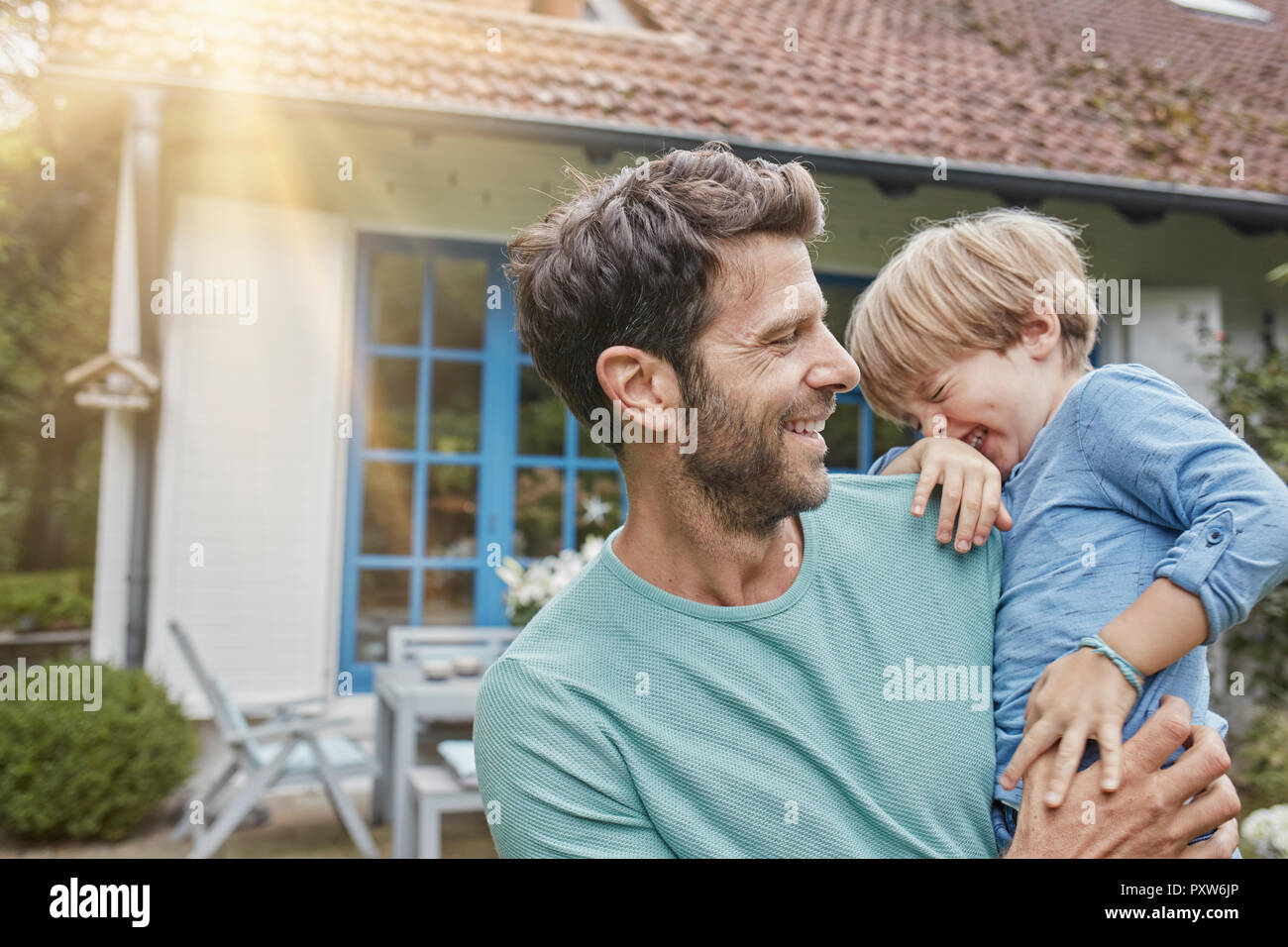 Father carrying her hi-res stock photography and images - Alamy