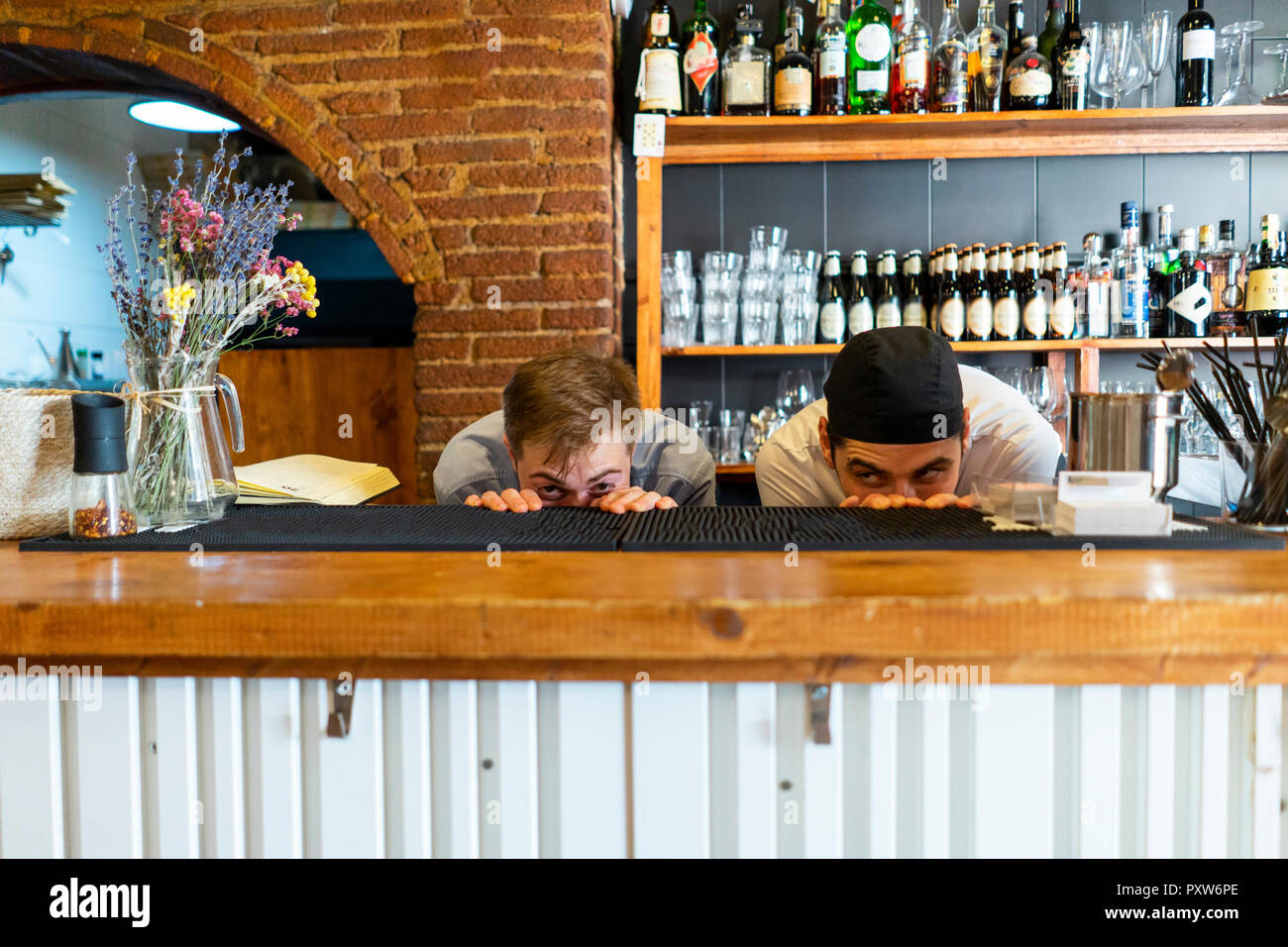 Two men behind bars hi-res stock photography and images - Alamy