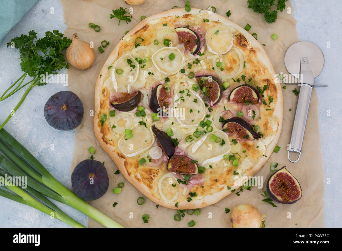 Homemade Tarte Flambee with figs, spring onions and goat cheese Stock ...