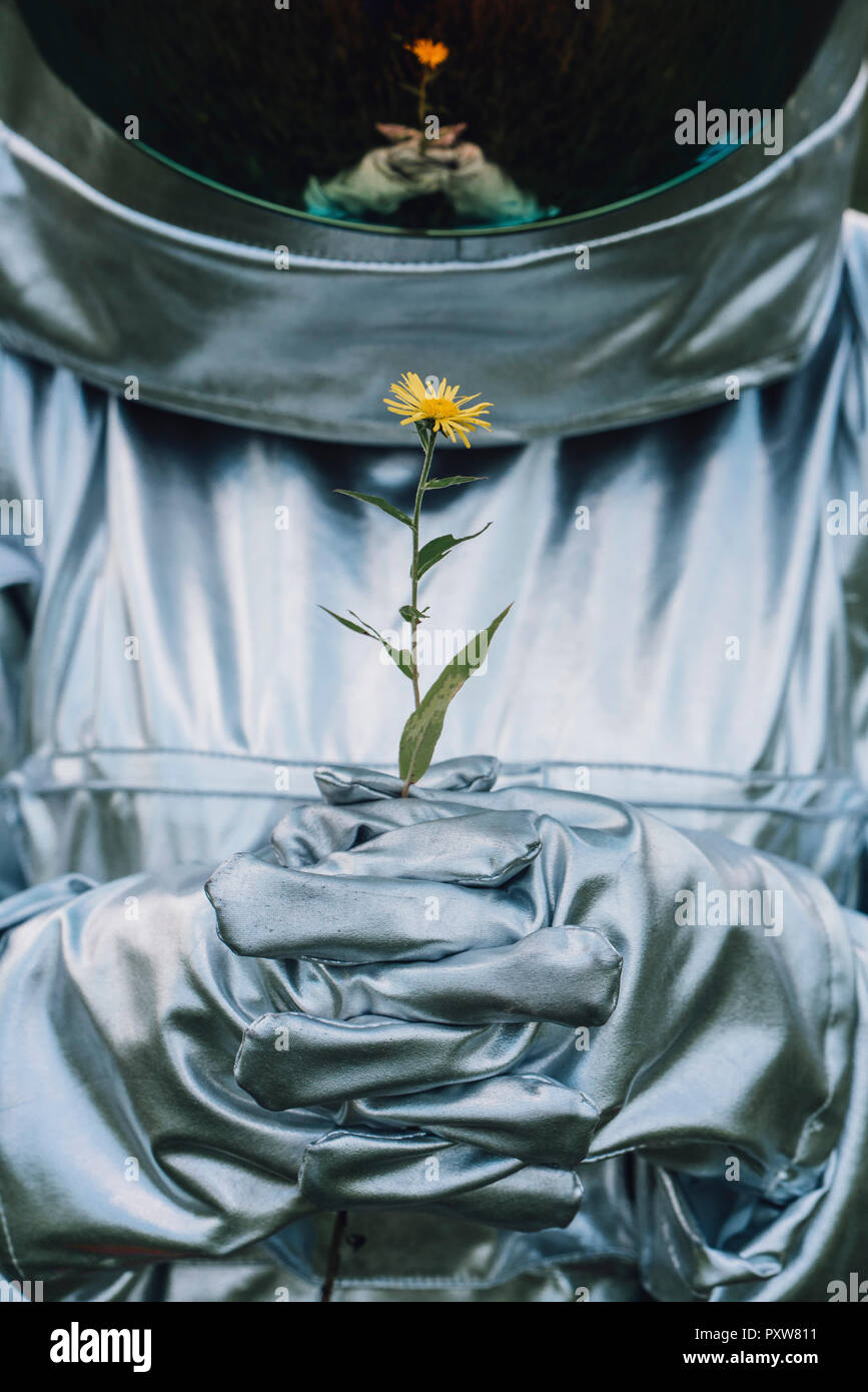 Spaceman holding flower hi-res stock photography and images - Alamy