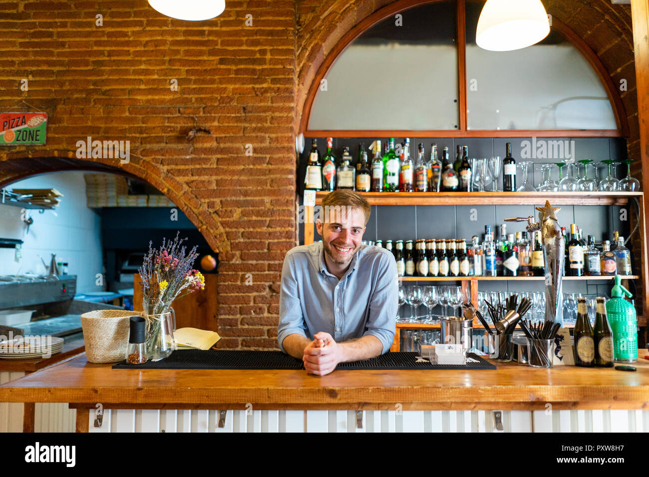 Man leaning on counter High Resolution Stock Photography and Images - Alamy