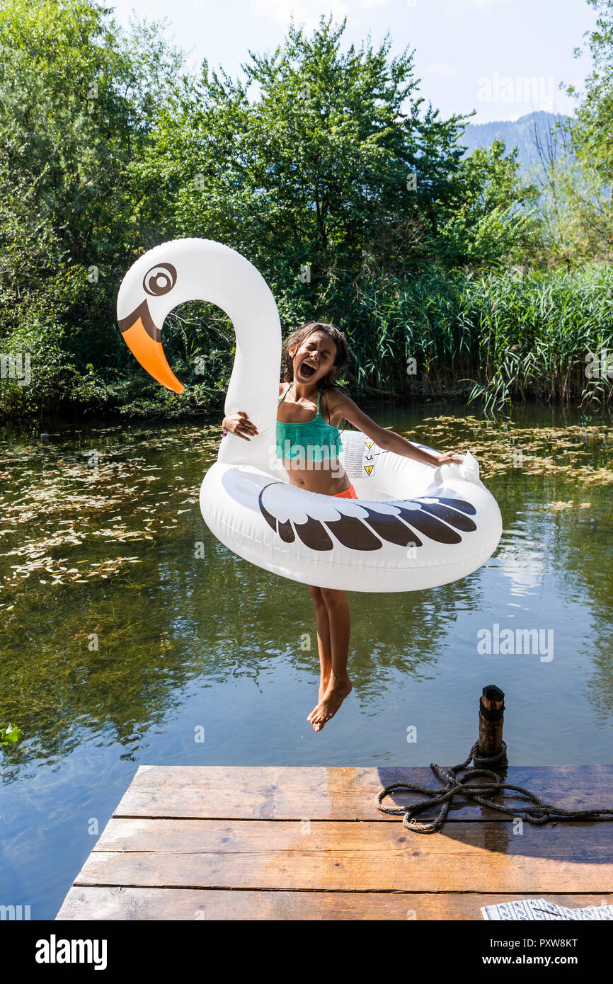Girls jumping in the water hi-res stock photography and images - Alamy