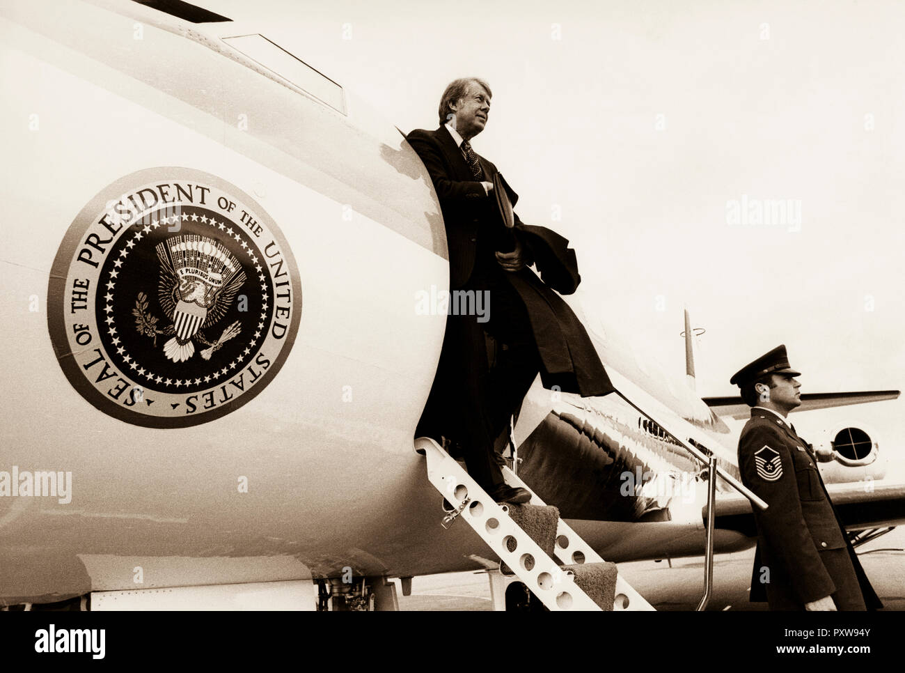 President Jimmy Carter at the doorway of Air Force One after landing ...