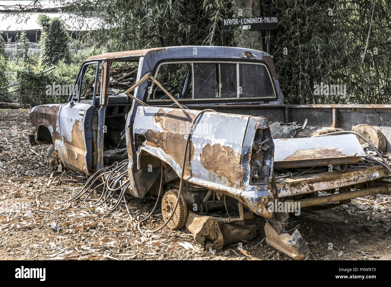 rusted car wreck in a Hill Tribe Village Stock Photo - Alamy