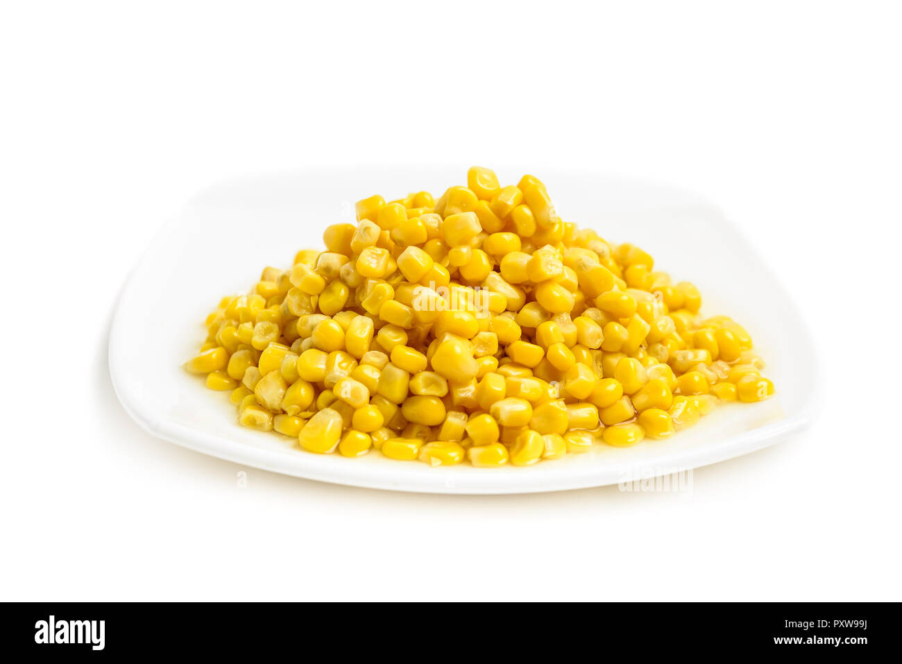 Corn on white plate isolated. Side view Stock Photo - Alamy