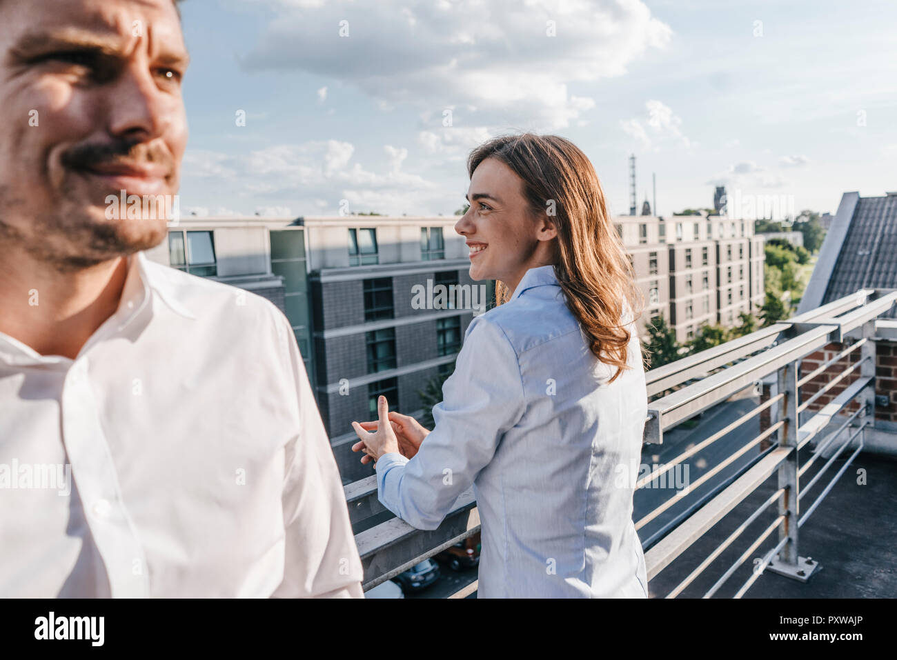 Business people standing on balcony Stock Photo - Alamy