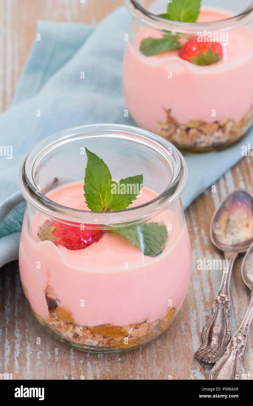 Two glasses of strawberry trifle with mascarpone cream and Amarettini ...