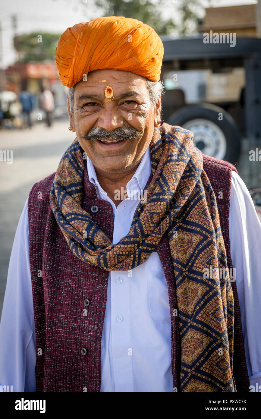 A local Rajasthani man wearing a colourful turban in the desert city of ...