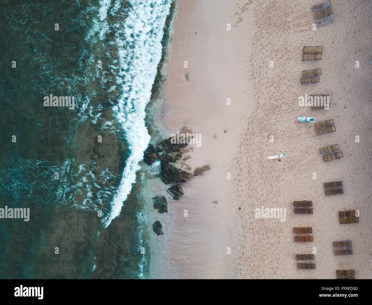 Indonesia, Bali, Aerial view of Balangan beach, empty beach loungers ...