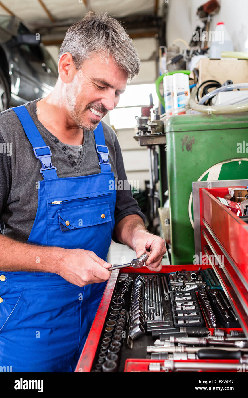 Professional toolbox with modern tools at garage Stock Photo - Alamy
