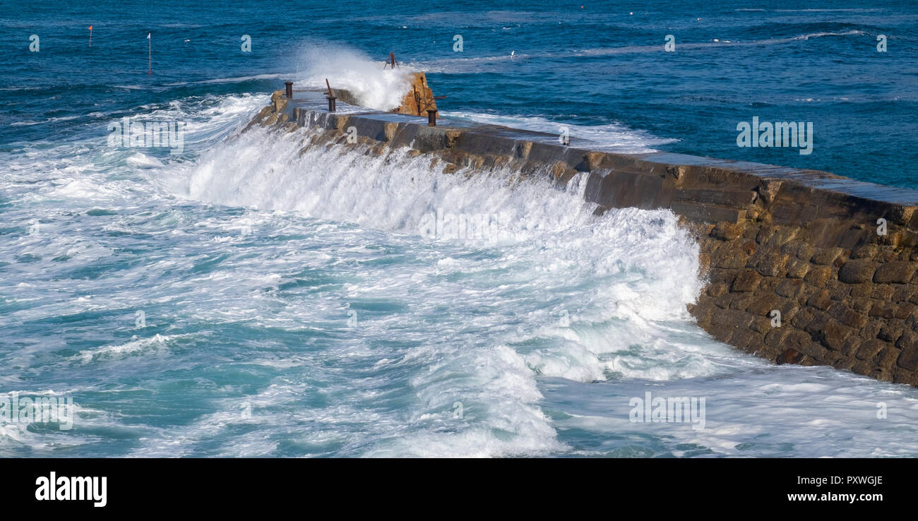 People facing the risk of being swept away when massive sea waves ...